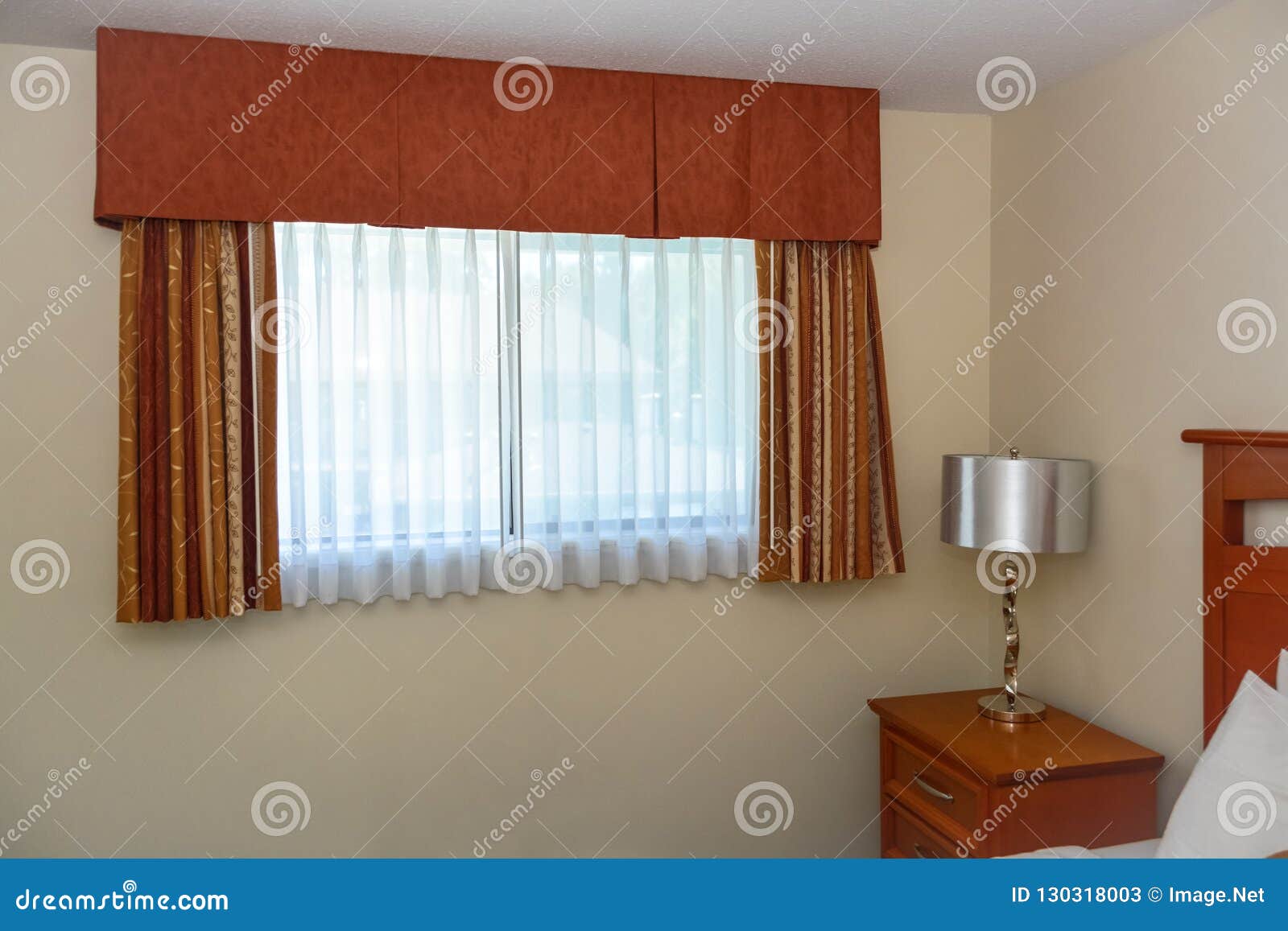 Window with the Curtains and Bedside Table in the Corner of the Stock ...