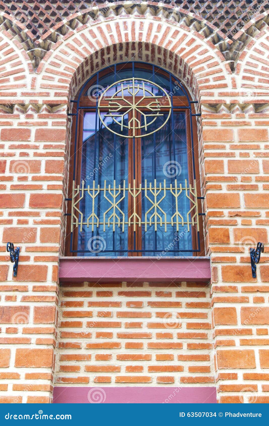 Window with Decorative Metal Grid on Stylish Brick Wall Stock Photo ...