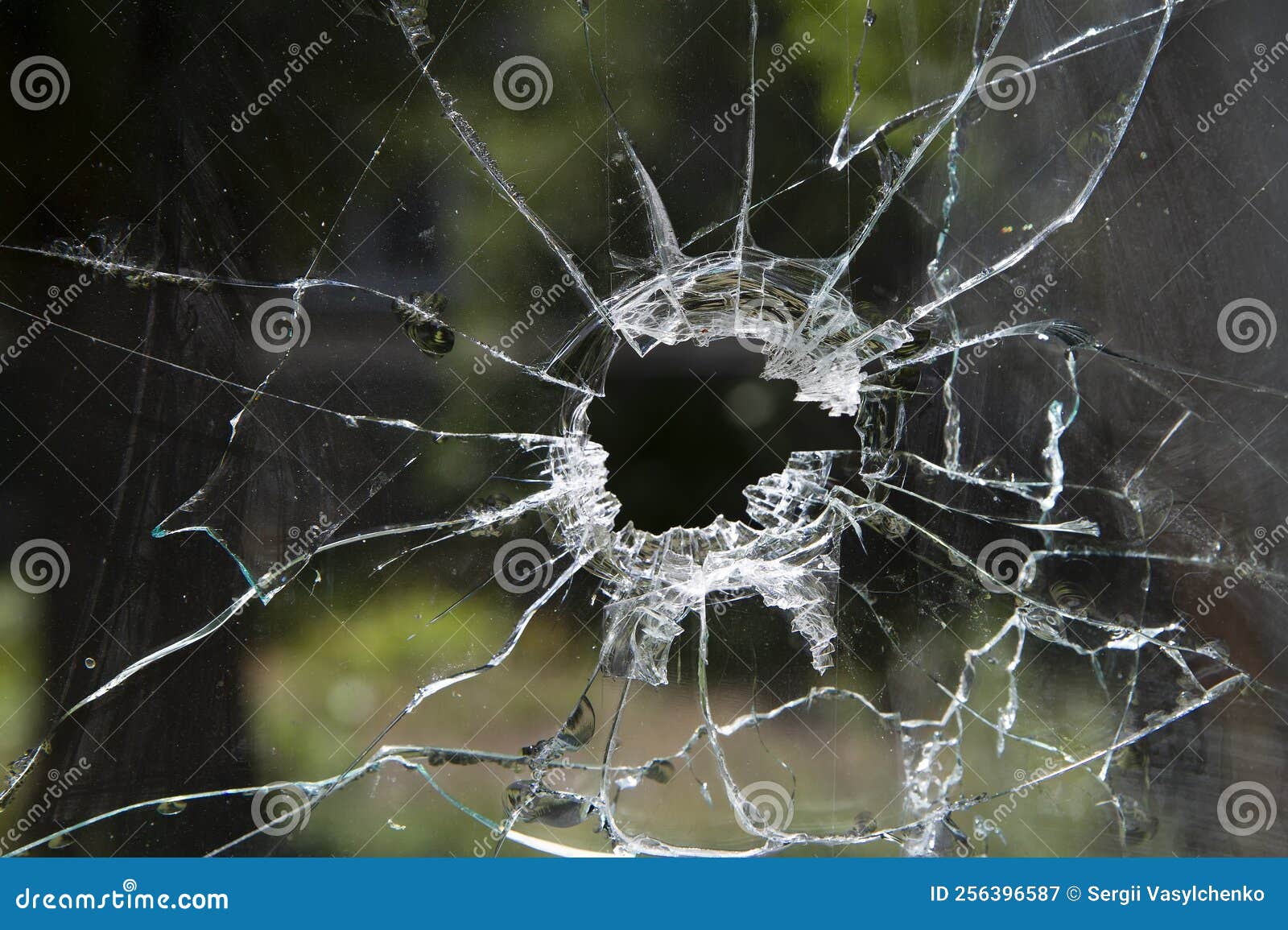 Window Glass Broken by a Bullet. Aftermath of Hostilities Stock Image ...
