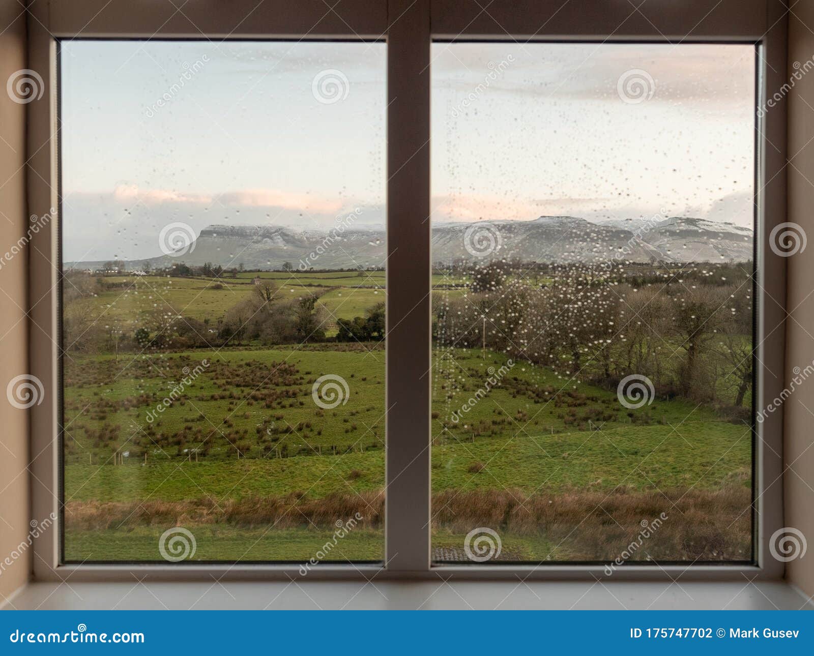 Window in a House with Beautiful Scenery with Green Fields and ...
