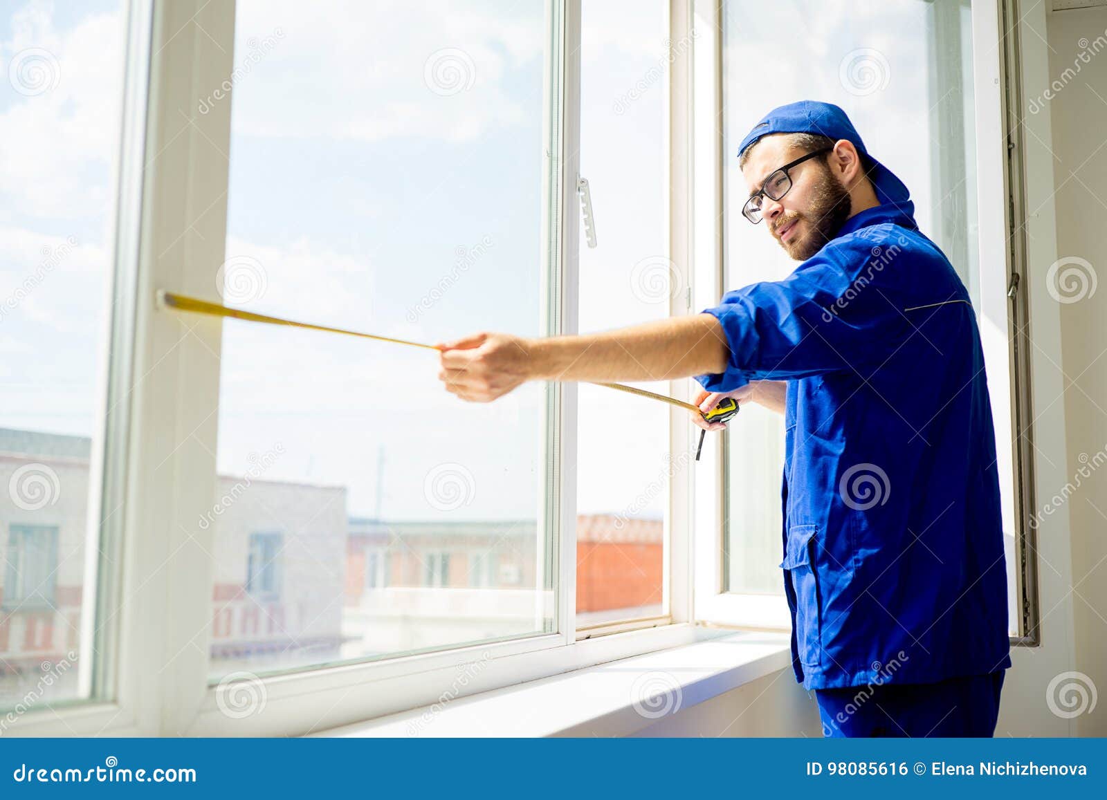Window installation worker stock photo. Image of expertise - 98085616