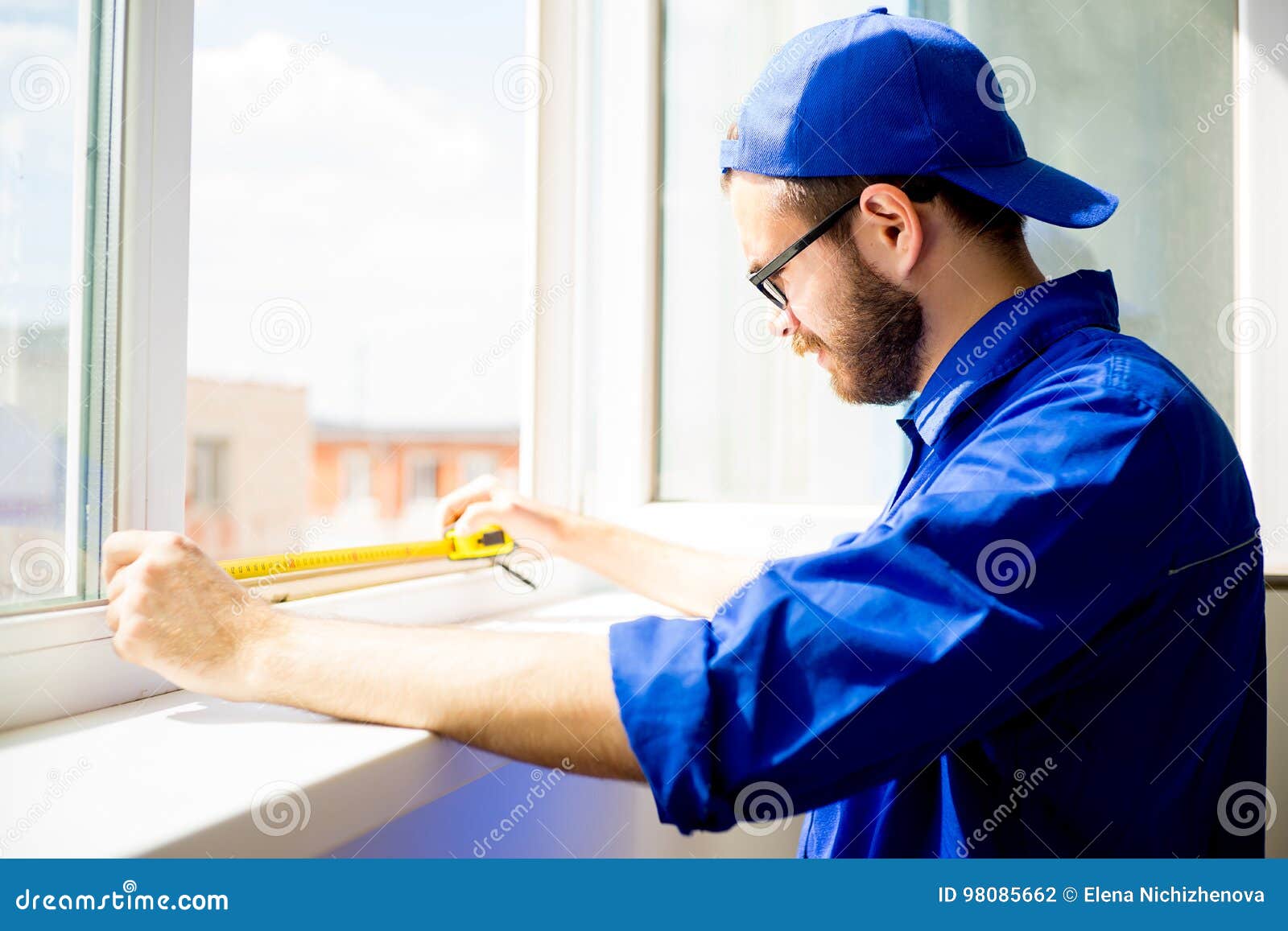 Window installation worker stock photo. Image of person - 98085662