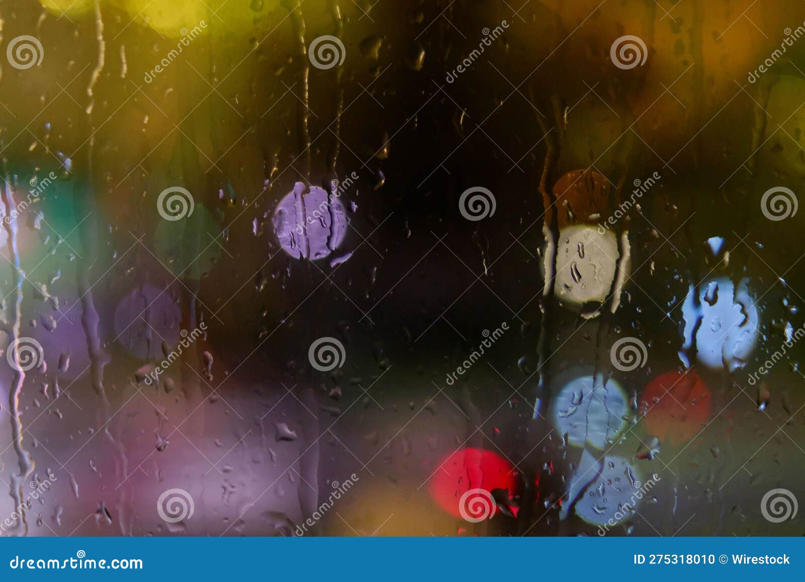 A Window with Many Colorful Lights in it Behind it are Rain Drops Stock ...