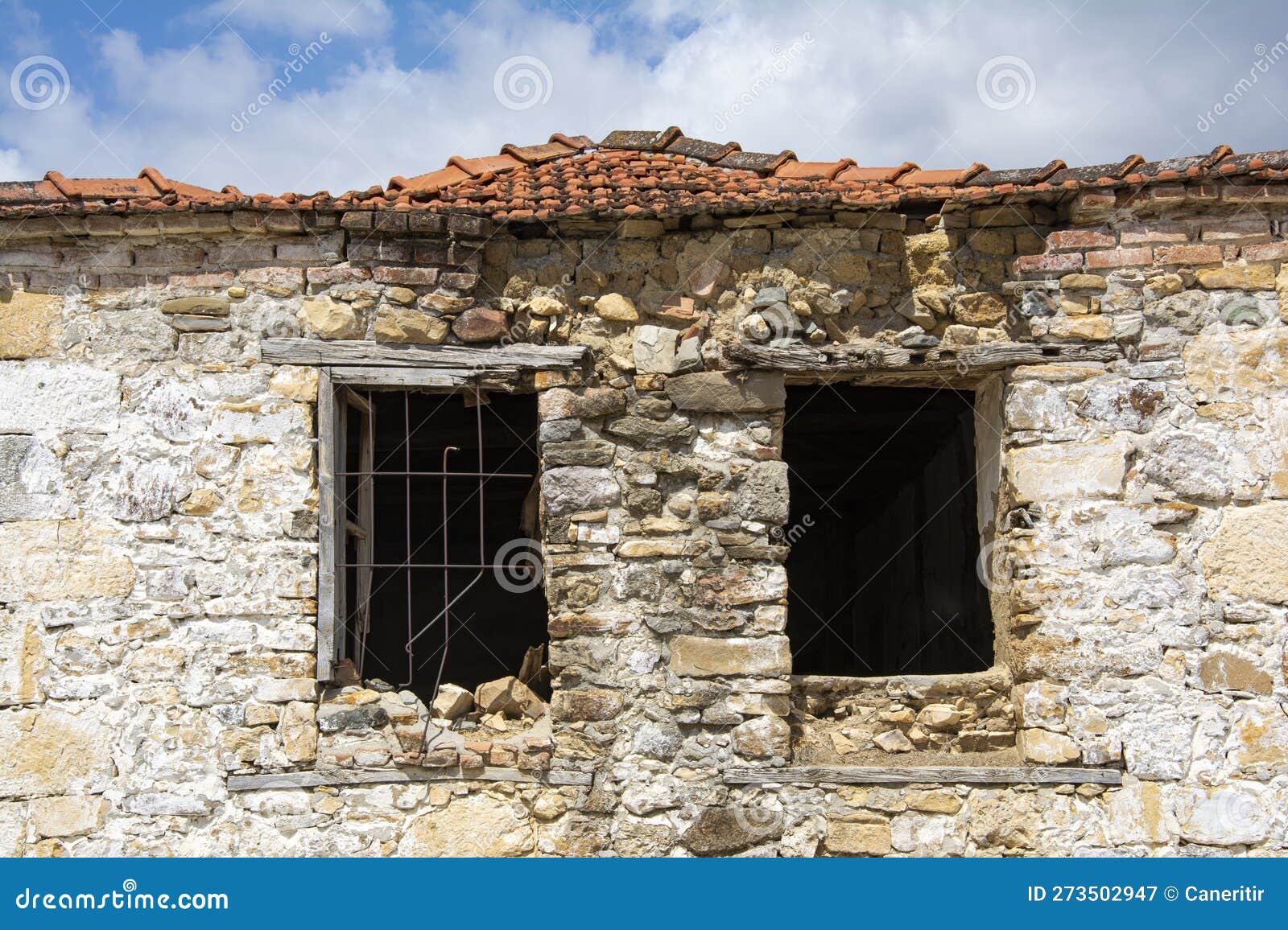 The Window of an Old Stone House with a Broken Window in the Foreground ...