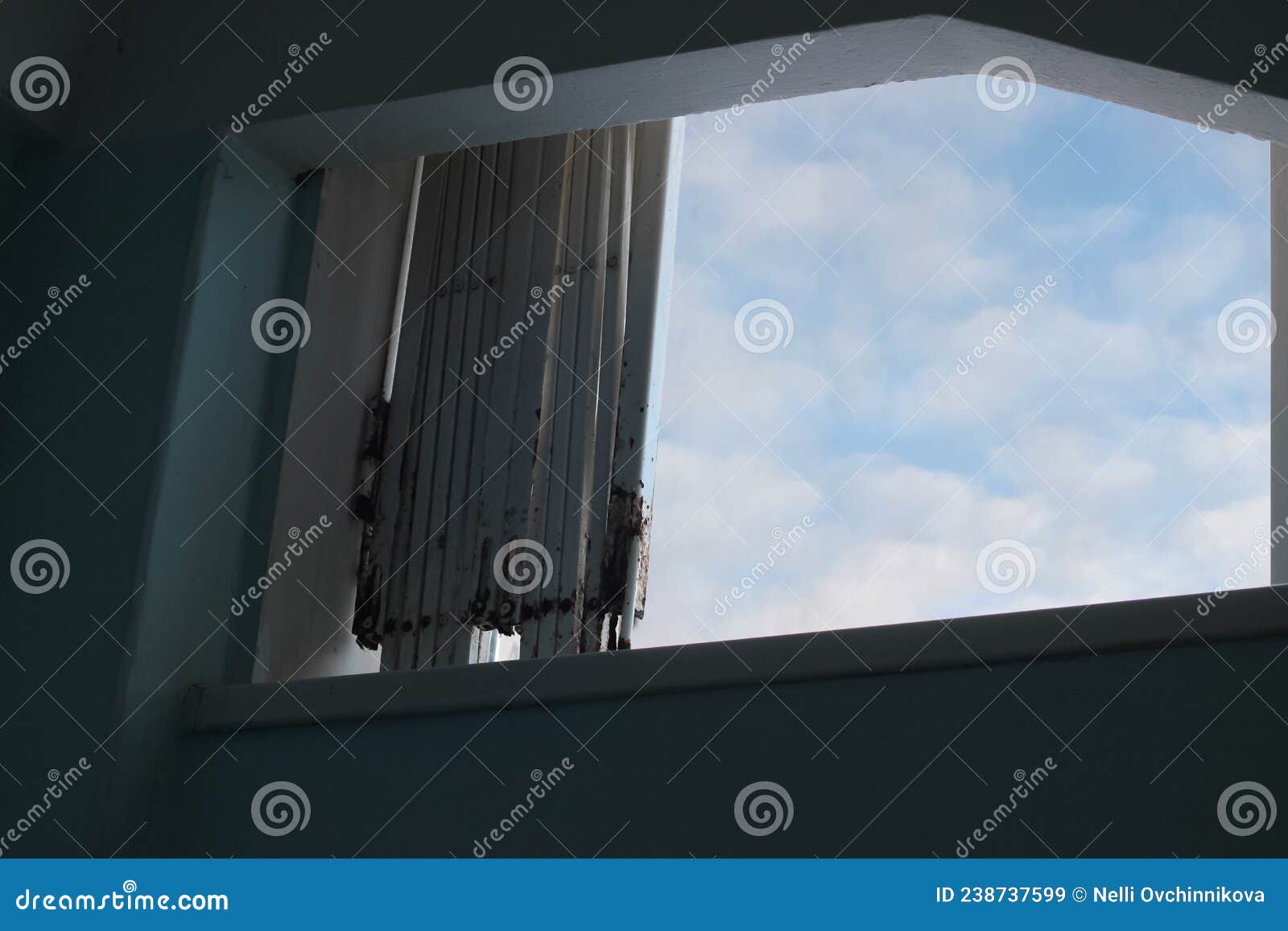 Window Overlooking the Cloudy Sky in the Dark Basement, the Old Rusty ...