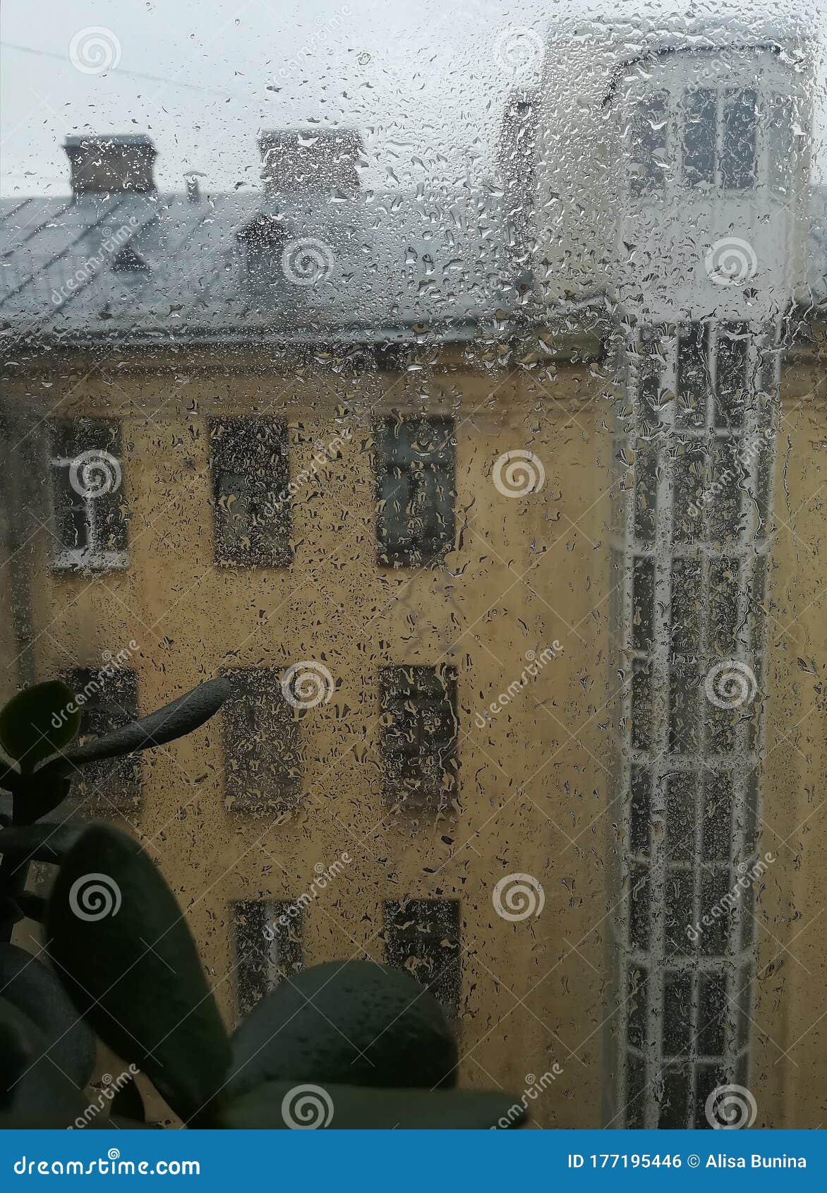 Window with Raindrops Overlooking an Old Building on a Cloudy Day Stock ...
