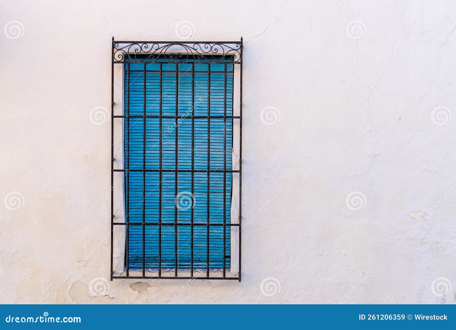 Window with a Rectangular Shape and Blue Shutters Enclosed with Metal ...