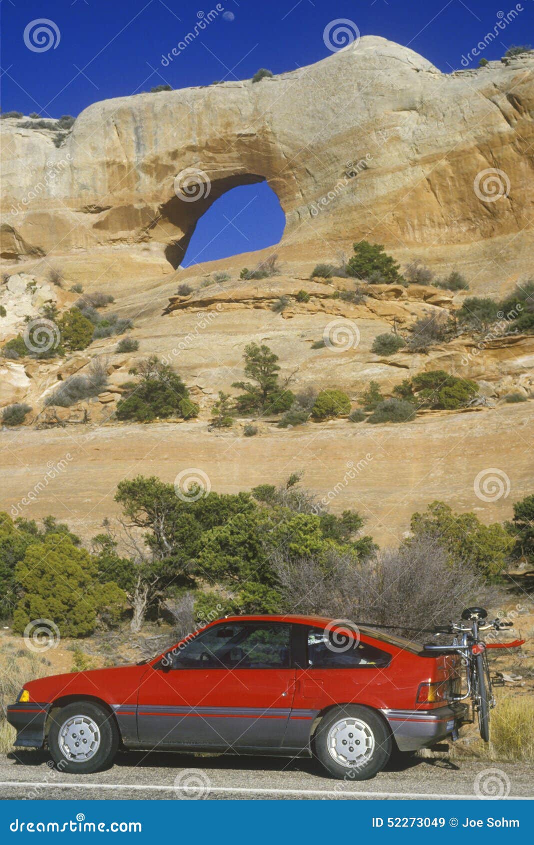 Window Rock Arch in Southern UT with Red Car in Foreground Editorial ...
