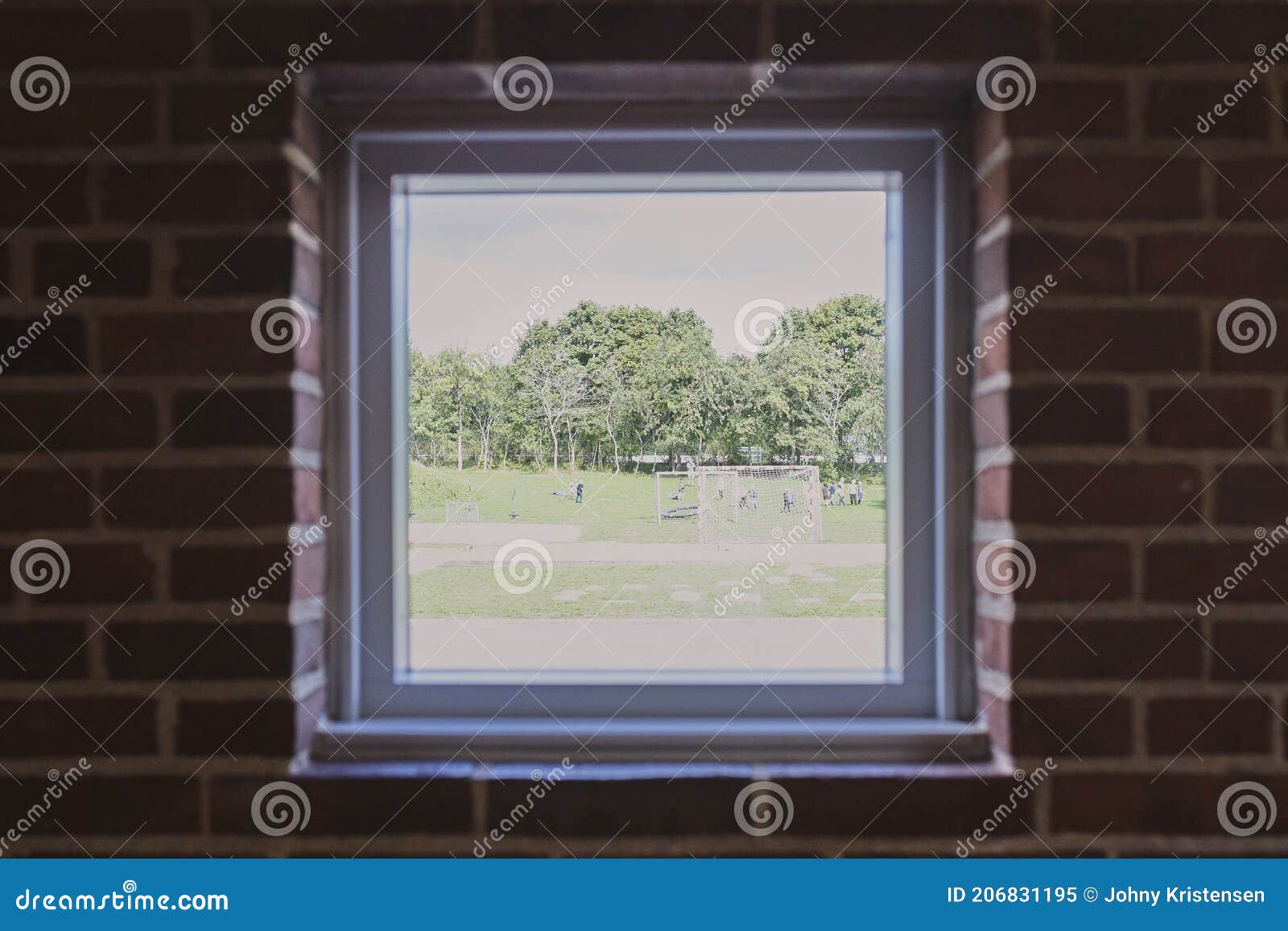 Window Showing Children Playing Soccer on Field Stock Image - Image of ...