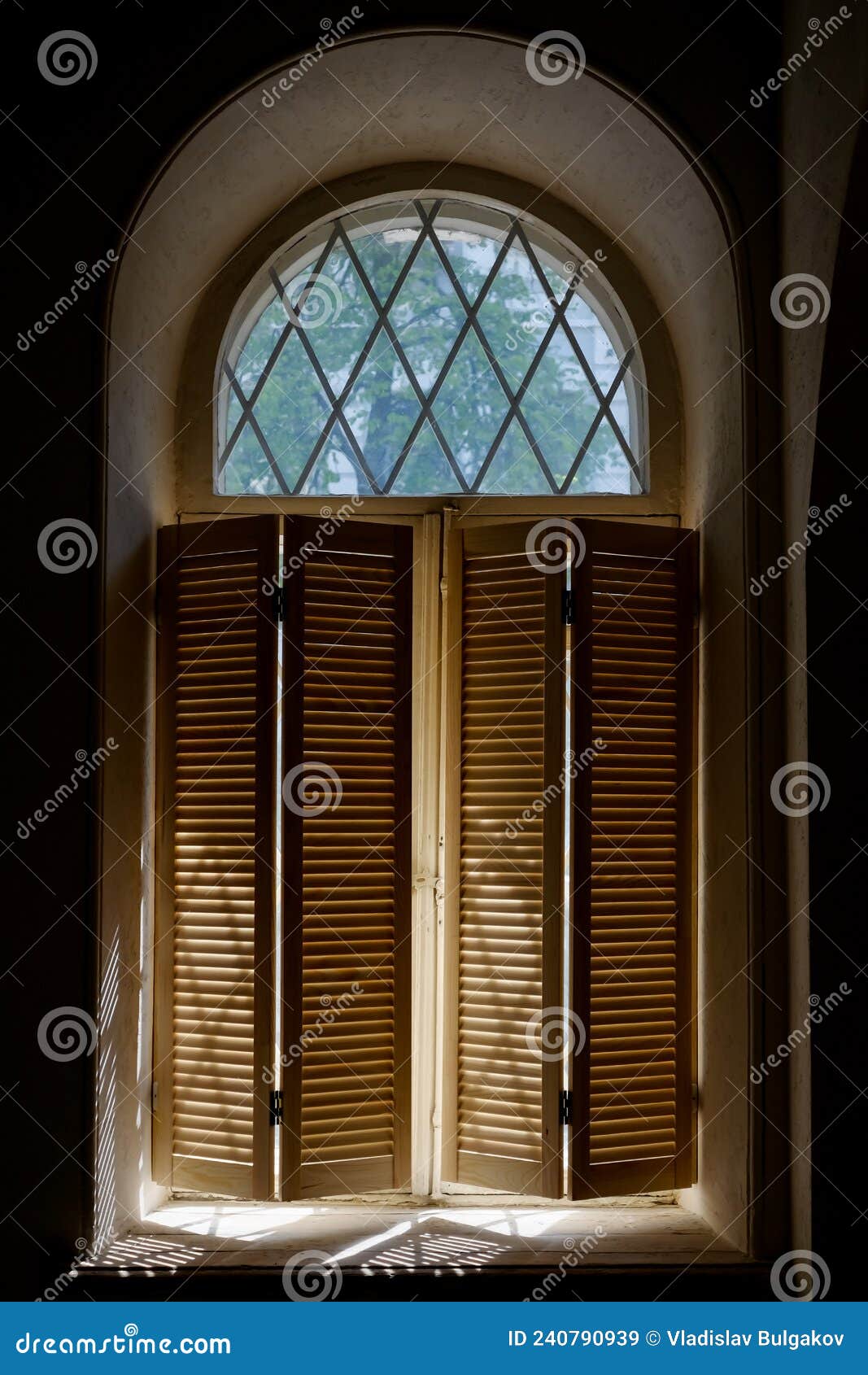 Window Shutters. Arched Windows with a Lattice.Light through the Arched ...