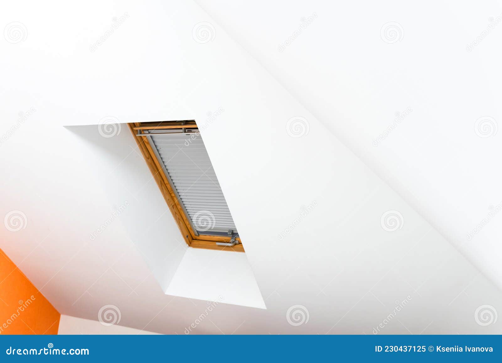 A Window on a Sloping Wall Under the Roof of a House with White Walls ...