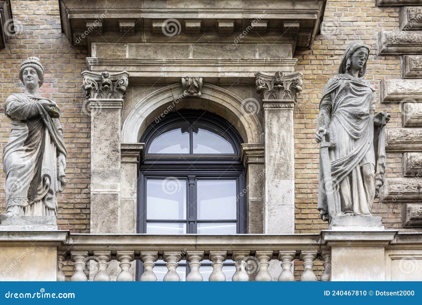Window with statues stock photo. Image of facade, frame - 240467810