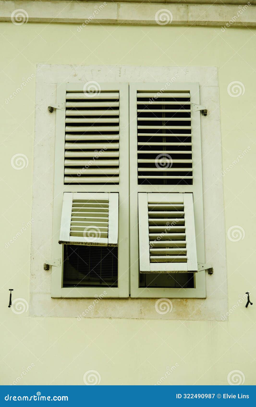 A Window with Two White Shutters and a Window Screen Stock Image ...