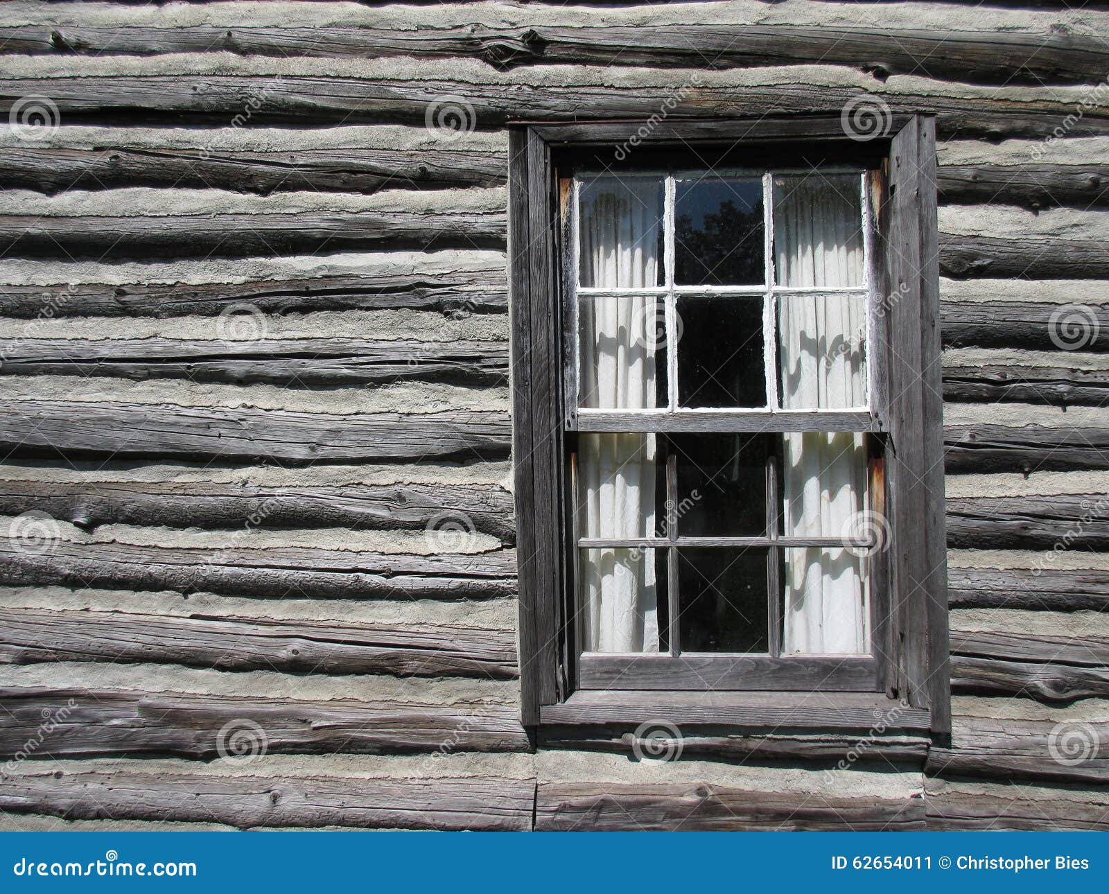 Window in a Wall of Logs stock image. Image of curtains - 62654011