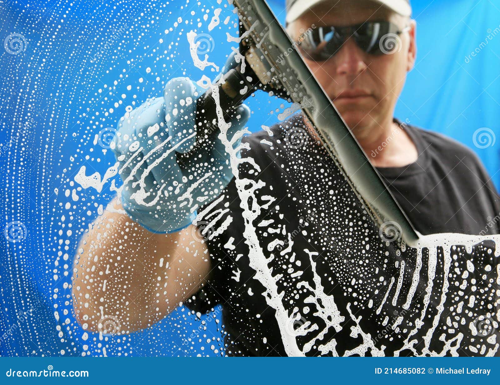 Window Washer Washing a Window Stock Photo - Image of glass, domestic ...