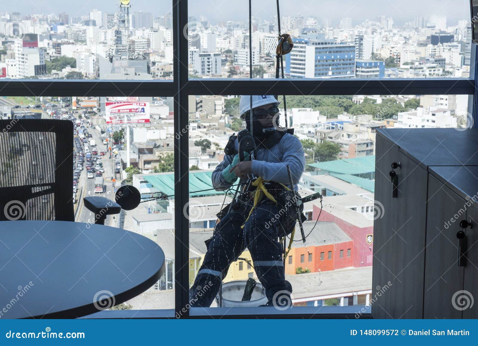 Window Washers Cleaning the Glass Facade of a Modern Building, High ...