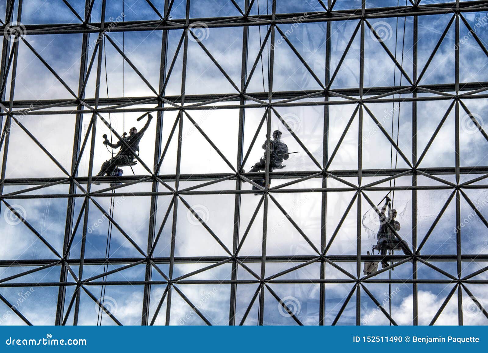 Window Washers Cleaning the Windows Outside of a Building Stock Photo ...