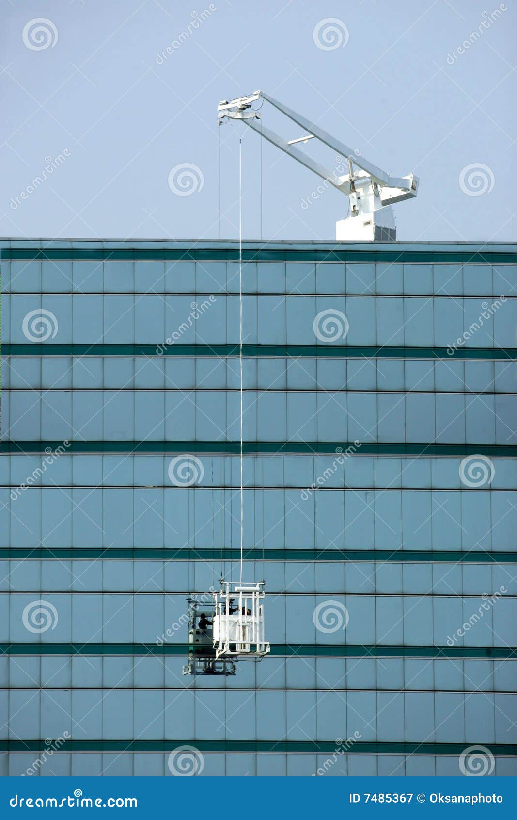 Window Washing Platform Suspended On Glass Facade Of A Skyscraper ...