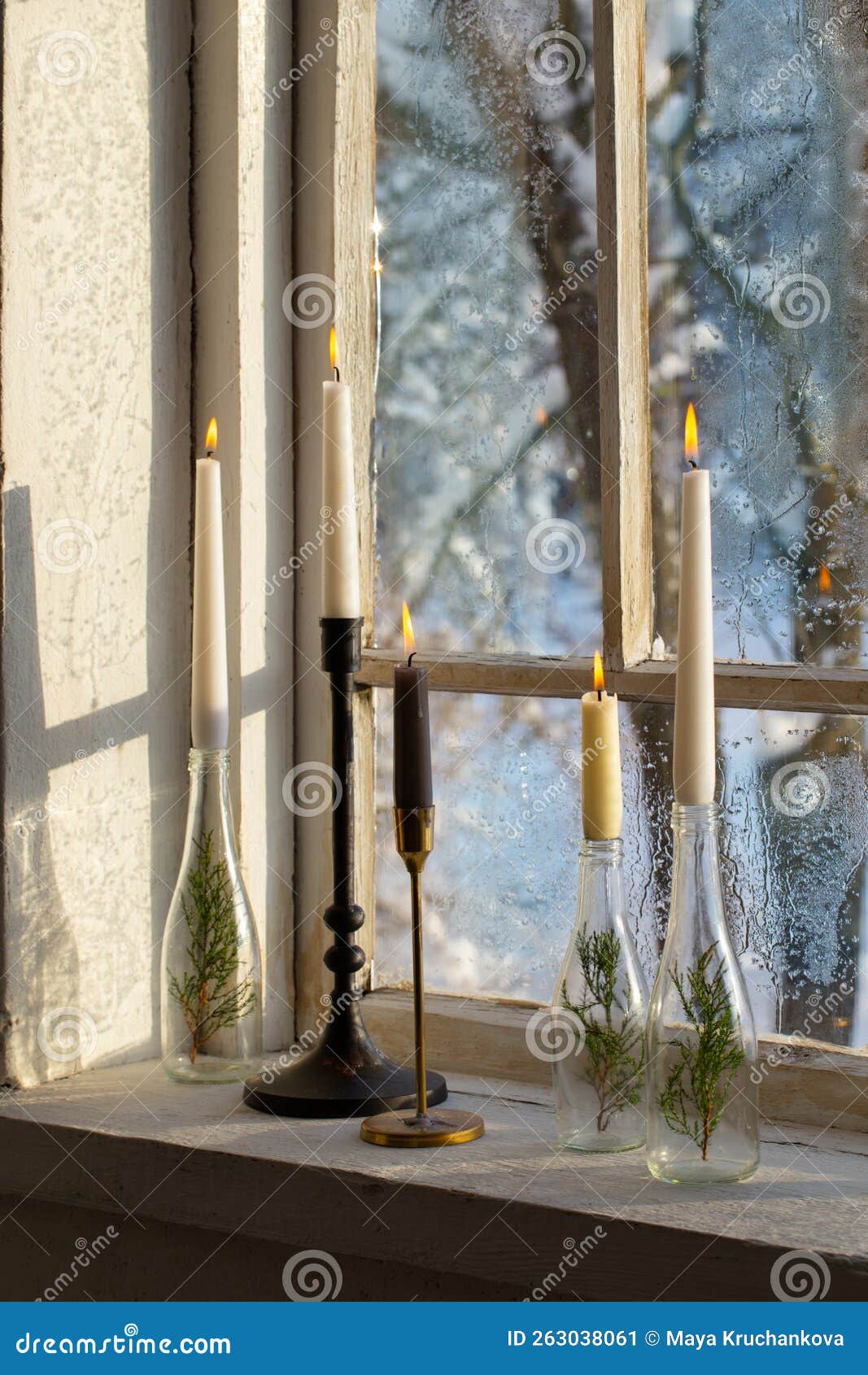 Window with Winter Landscape and Burning Candles on Windowsill Stock ...