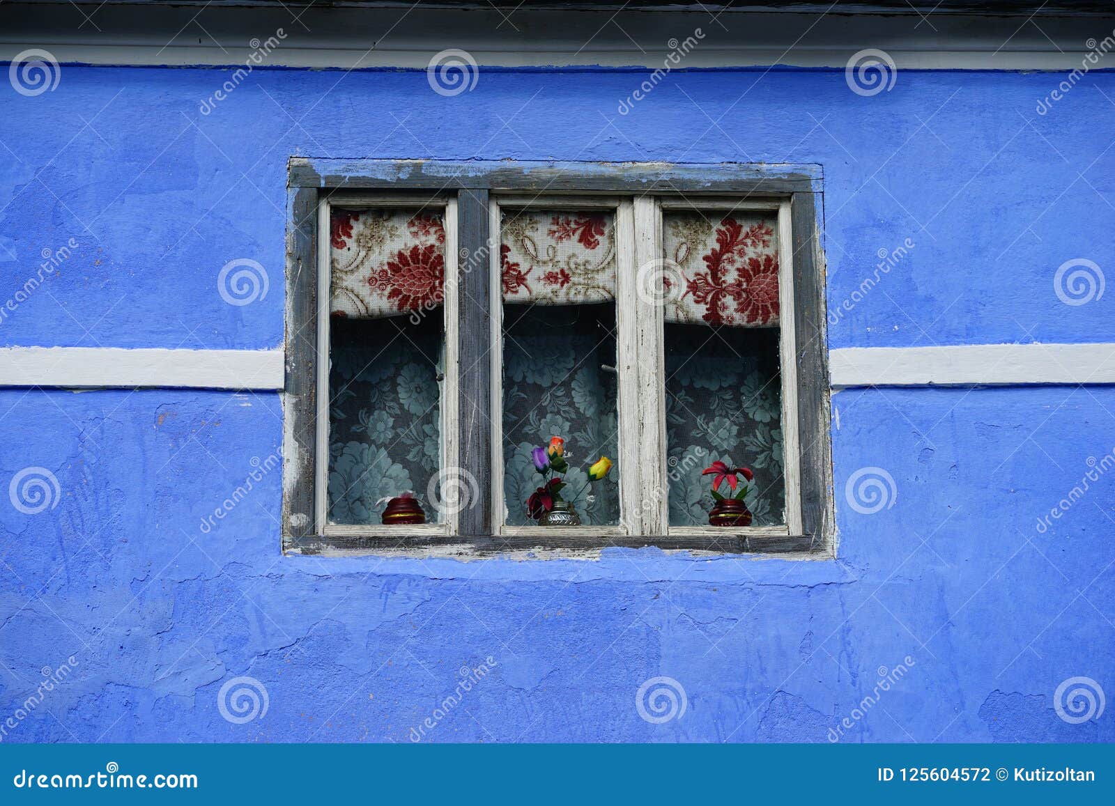 Windows on the blue house stock photo. Image of arrangements - 125604572