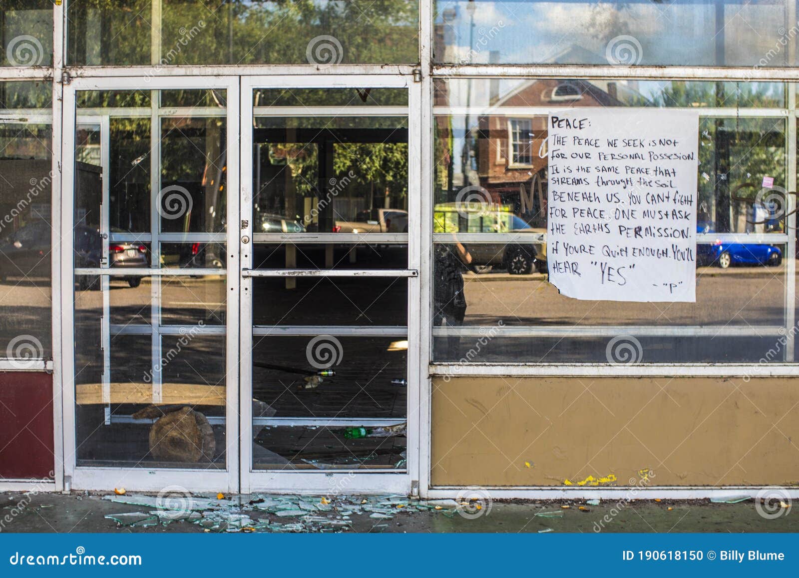 Windows Busted Out Downtown and a Sign with a Message Editorial Image ...
