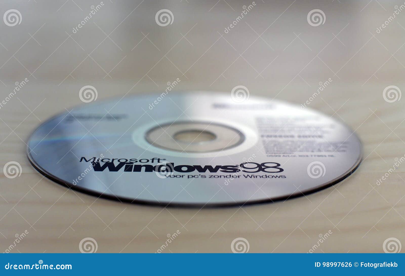 Windows 98 CD on the table editorial photo. Image of system - 98997626