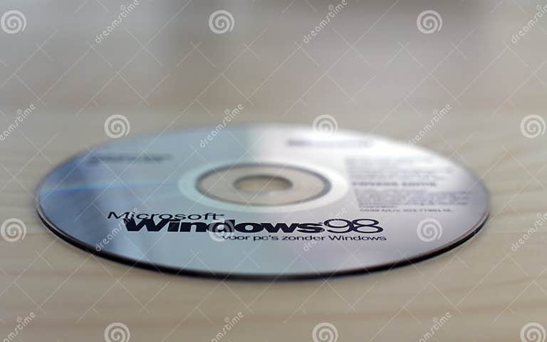 Windows 98 CD on the table editorial photo. Image of system - 98997626