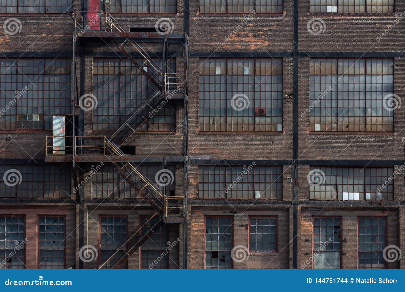 Windows, Doors, and Fire Escape on the Exterior of a Derelict ...