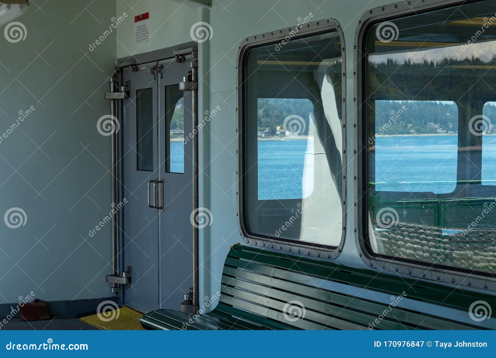 Windows of a Ferry Boat Reflecting and Showing the View of the Water ...