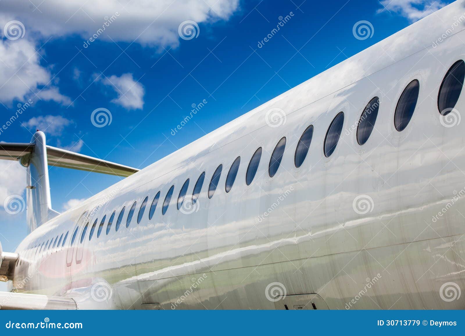 Fuselage Of Airplane With Door And Windows. Row Of Portholes Outside ...