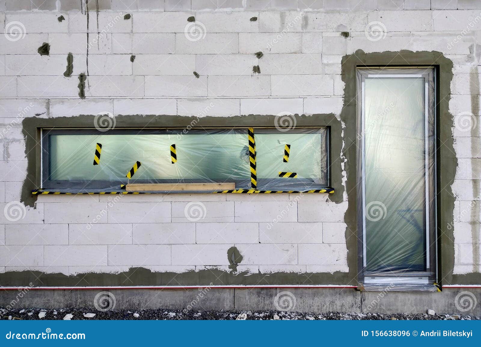 Windows of a House Under Construction Covered with Protective Plastic ...
