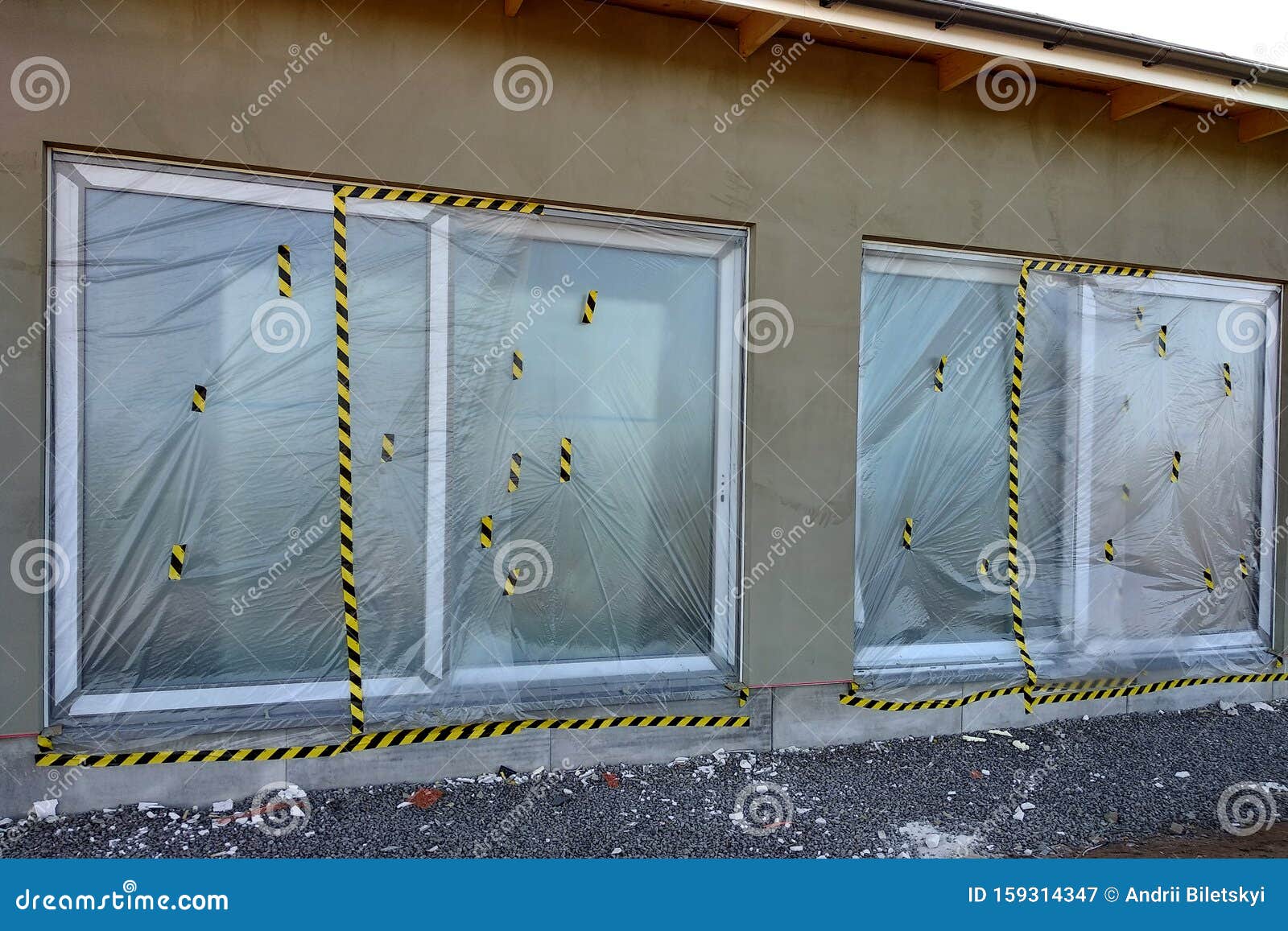 Windows of a House Under Construction Covered with Protective Plastic ...