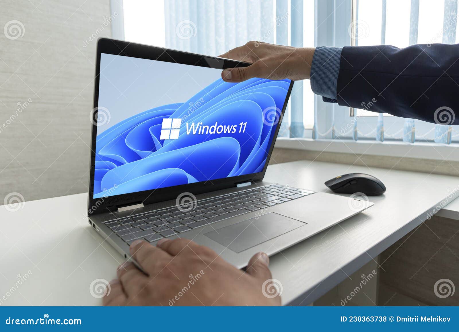 Windows 11 Logo on Laptop Screen. a New Operating System Update from ...