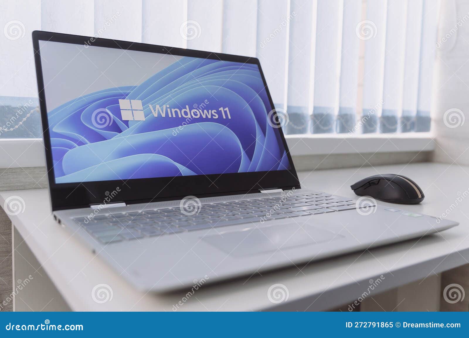 Windows 11 Logo on Laptop Screen. a New Operating System Update from ...