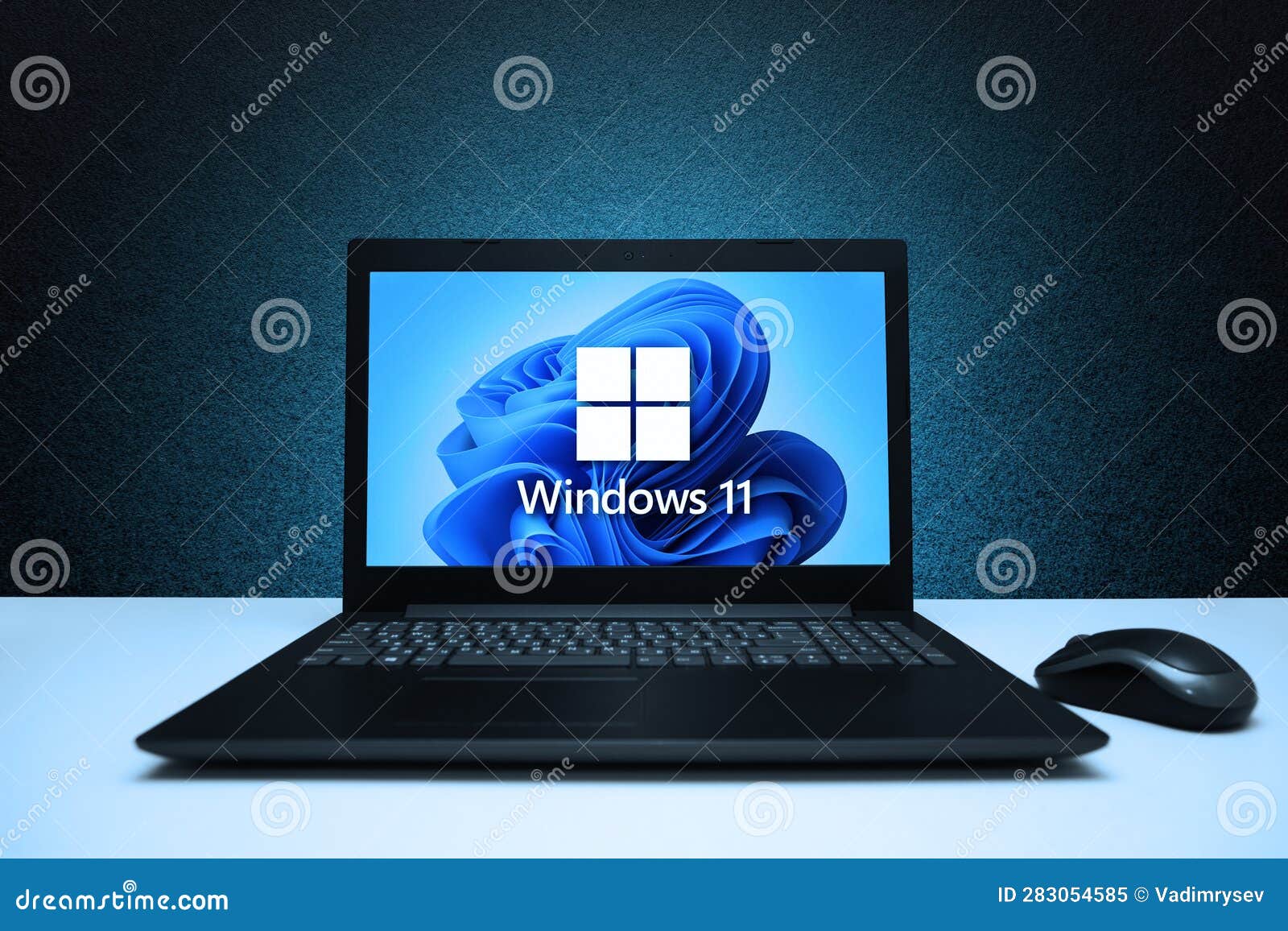 Windows 11 Logo on the Screen Laptop Computer with Mouse on Black ...
