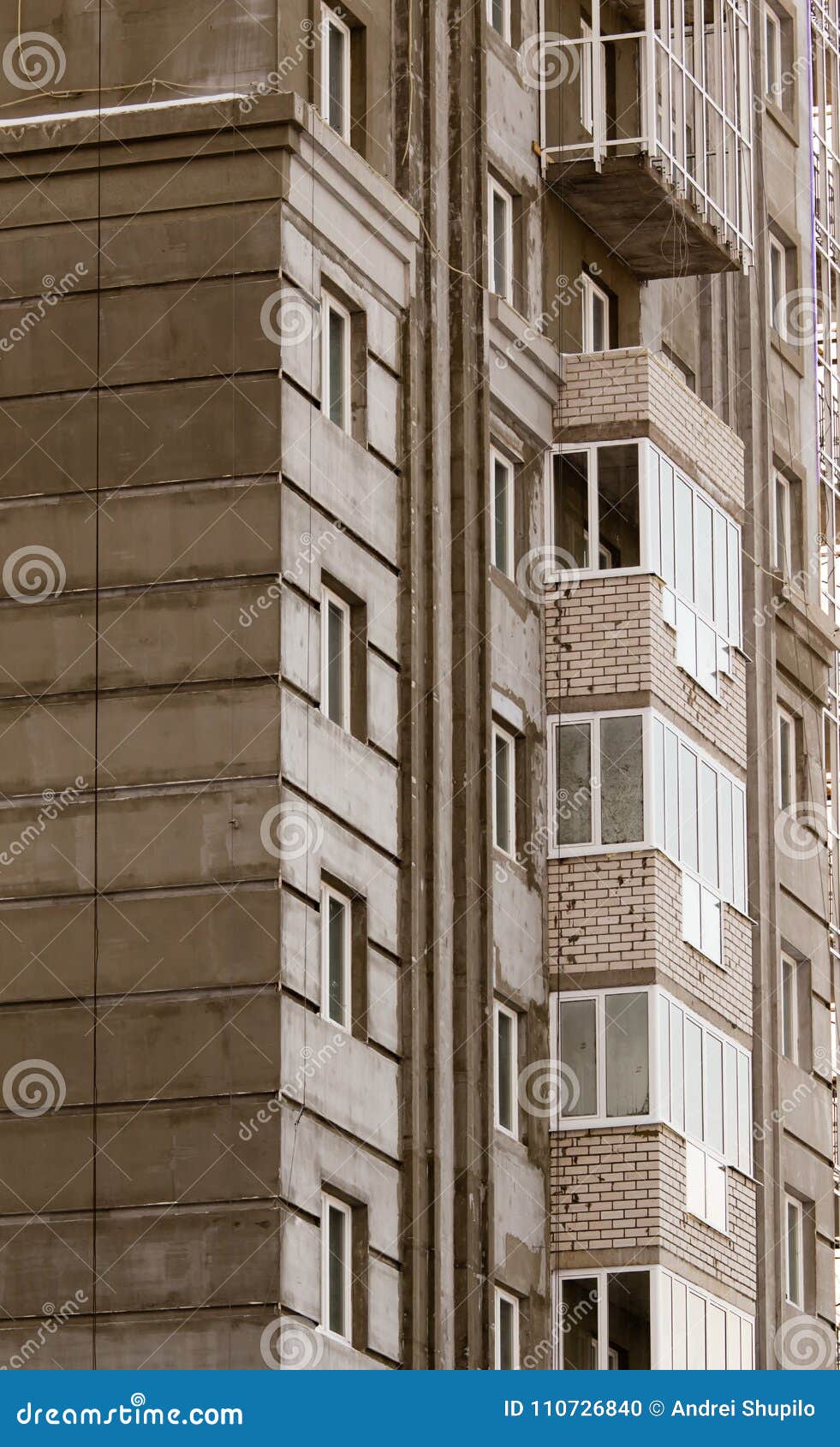Windows in a Multi-storey Building Under Construction As a Background ...