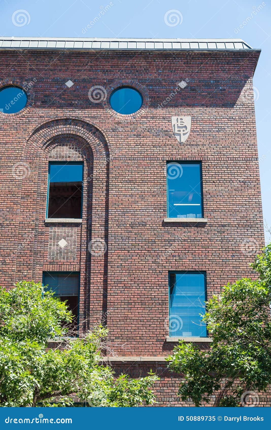 Windows on Old Brick Building with Cement Crest Stock Image - Image of ...