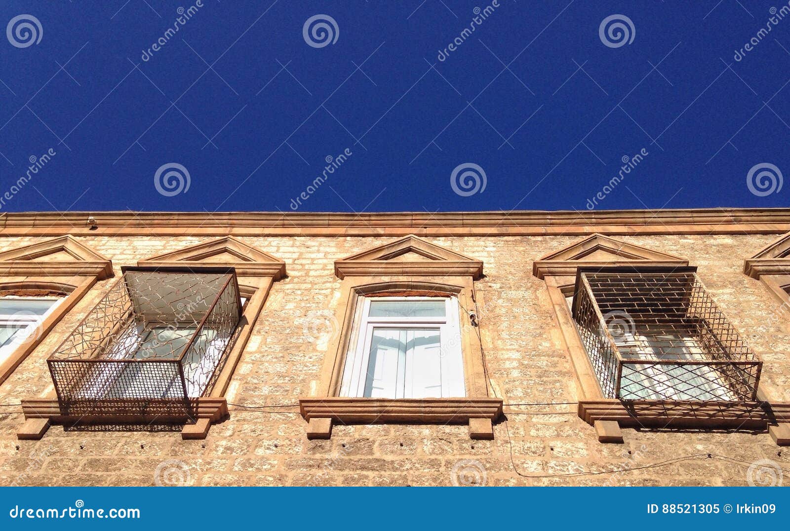 Windows of an old building stock image. Image of city - 88521305