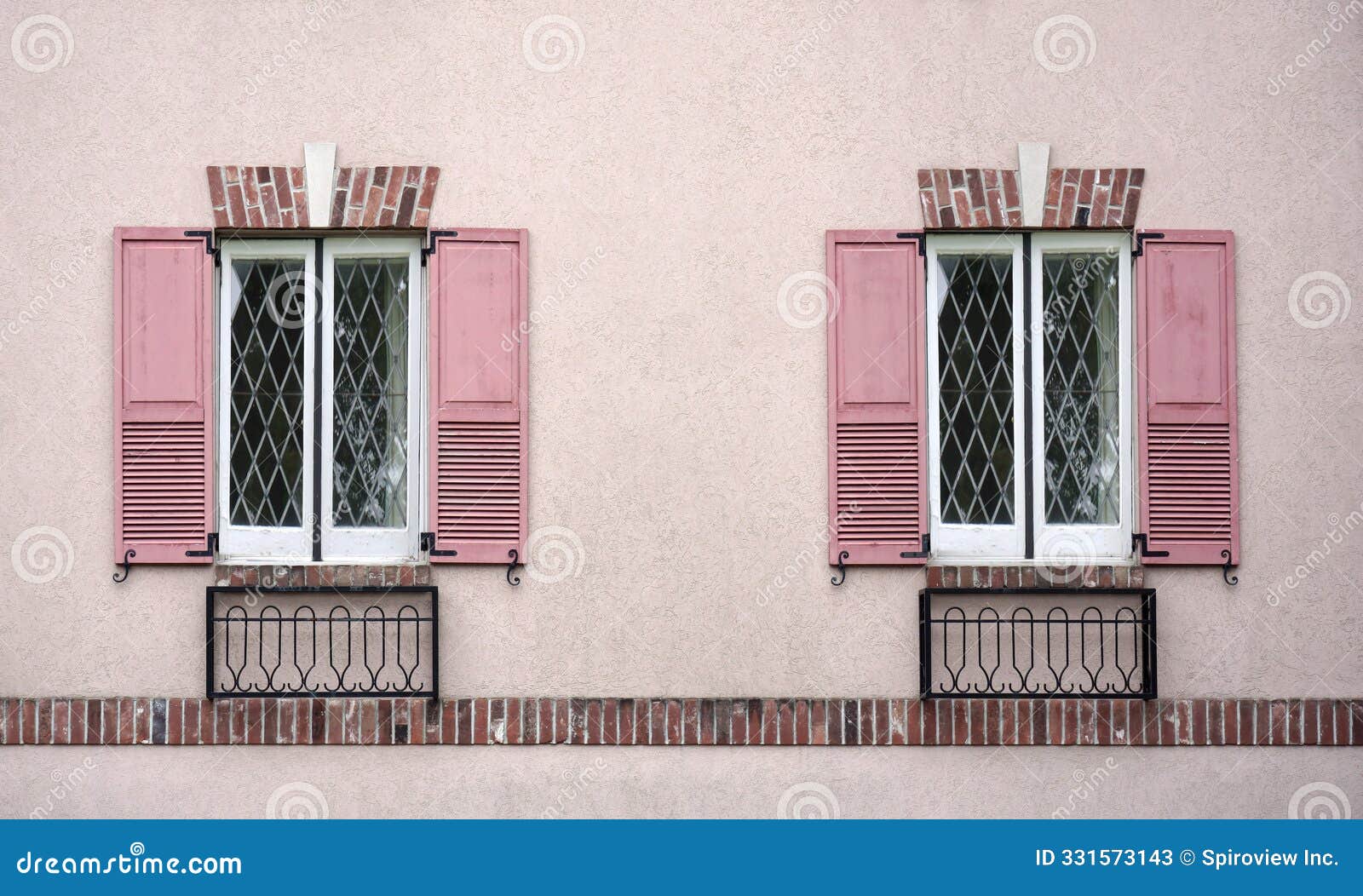 Windows with pink shutters stock image. Image of exterior - 331573143