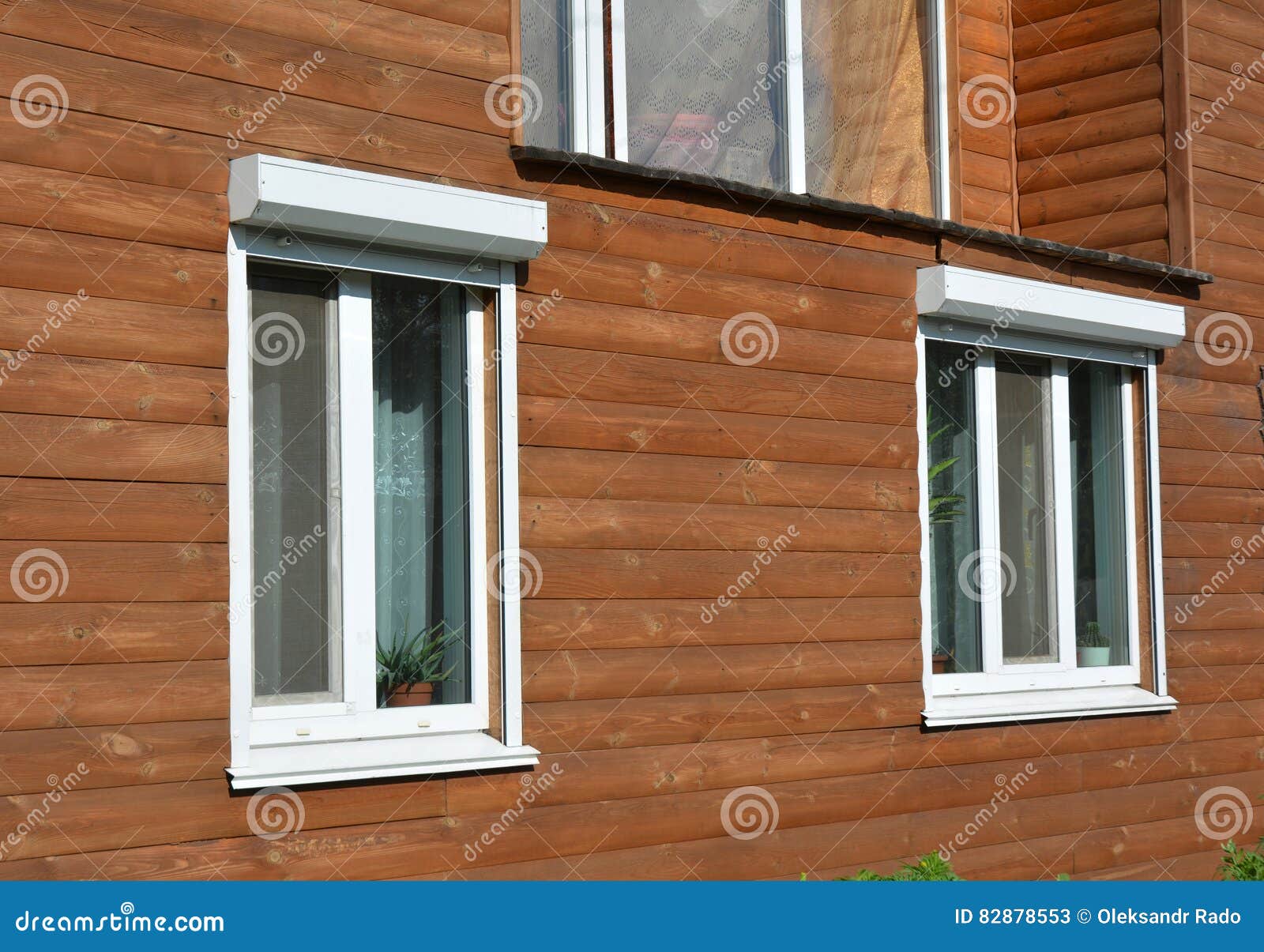 Windows with Rolling Shutter on the Wooden House Facade Exterior Stock ...