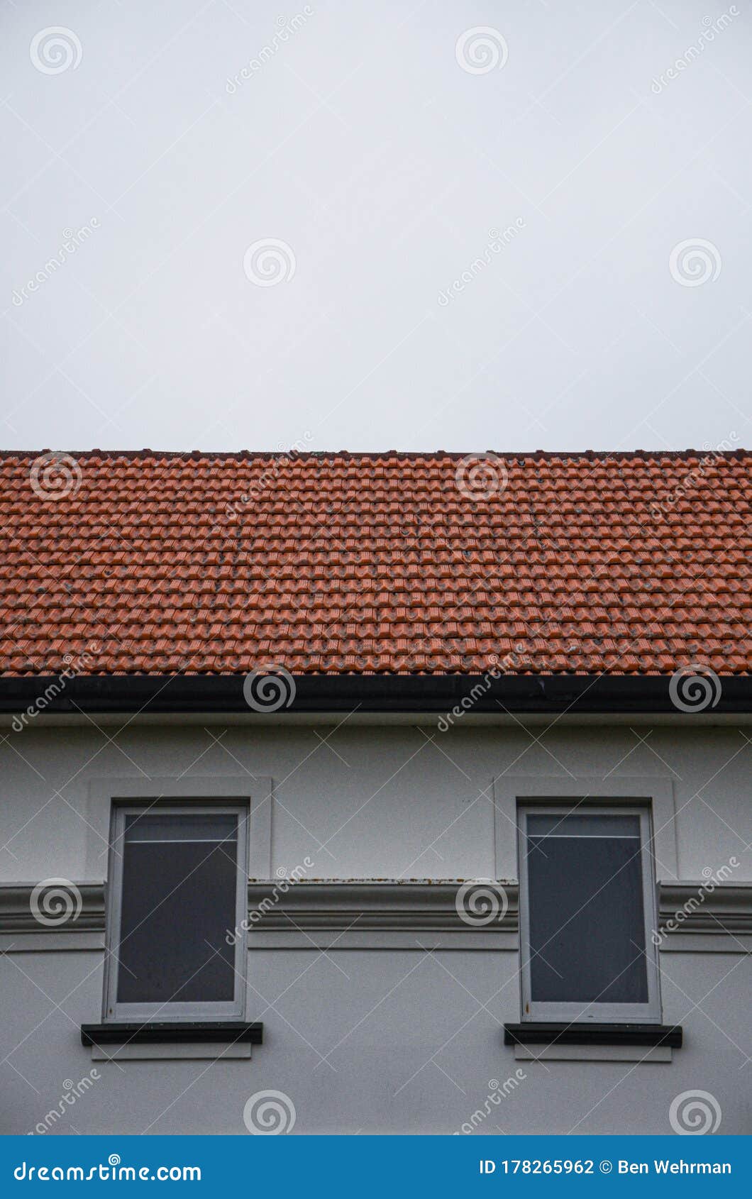 Windows on Side of a House with Orange Roof Stock Photo - Image of ...