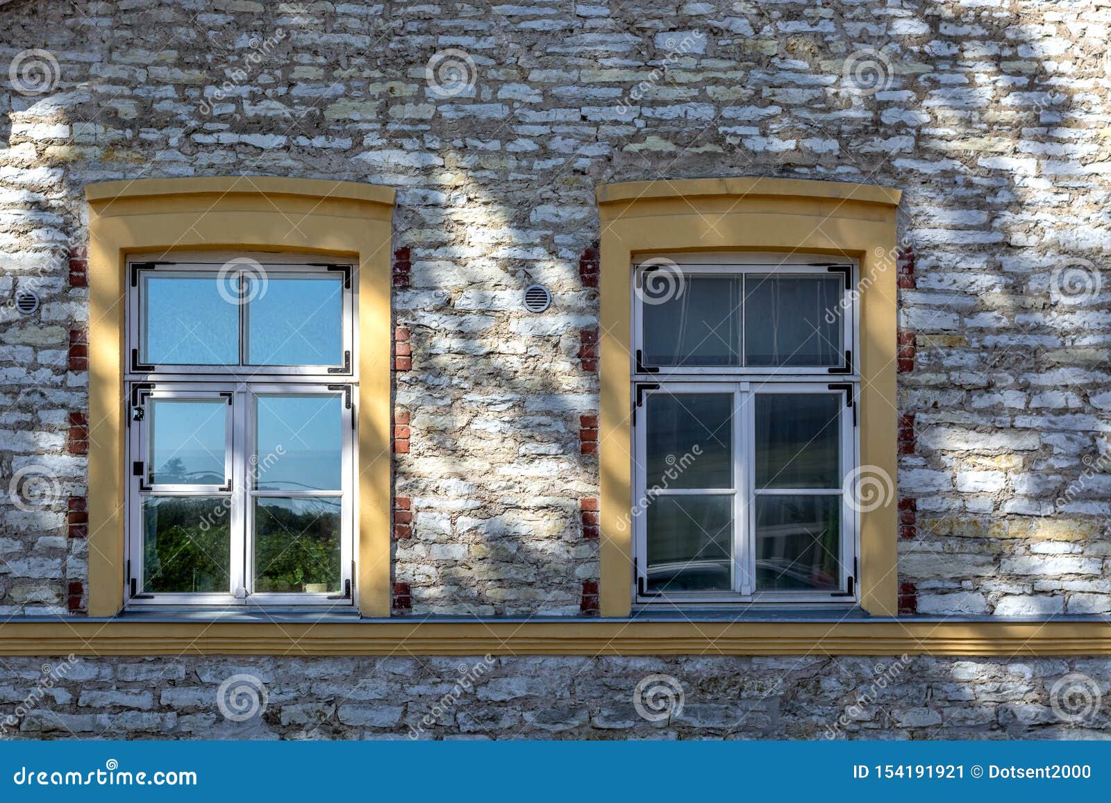 Windows on a stone wall stock image. Image of glass - 154191921