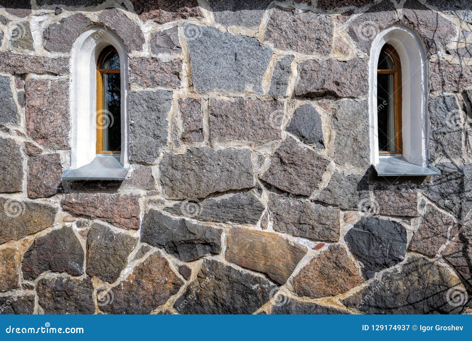 Windows in stone wall. stock image. Image of catholic - 129174937