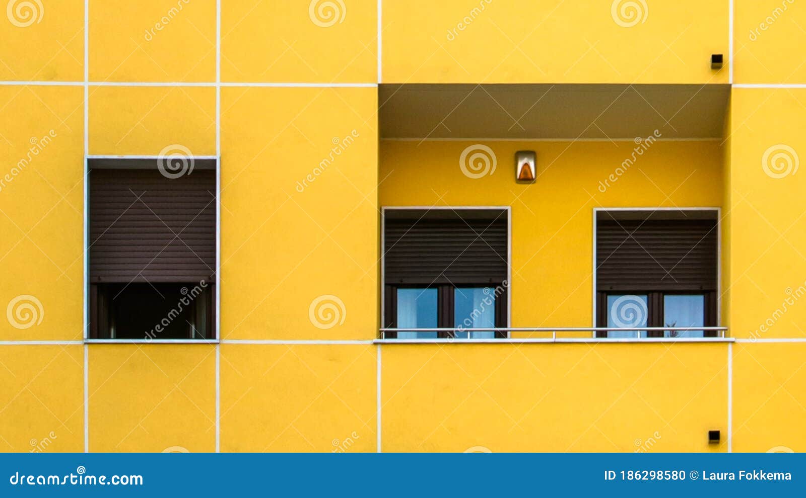 Windows in a yellow wall stock photo. Image of closed - 186298580