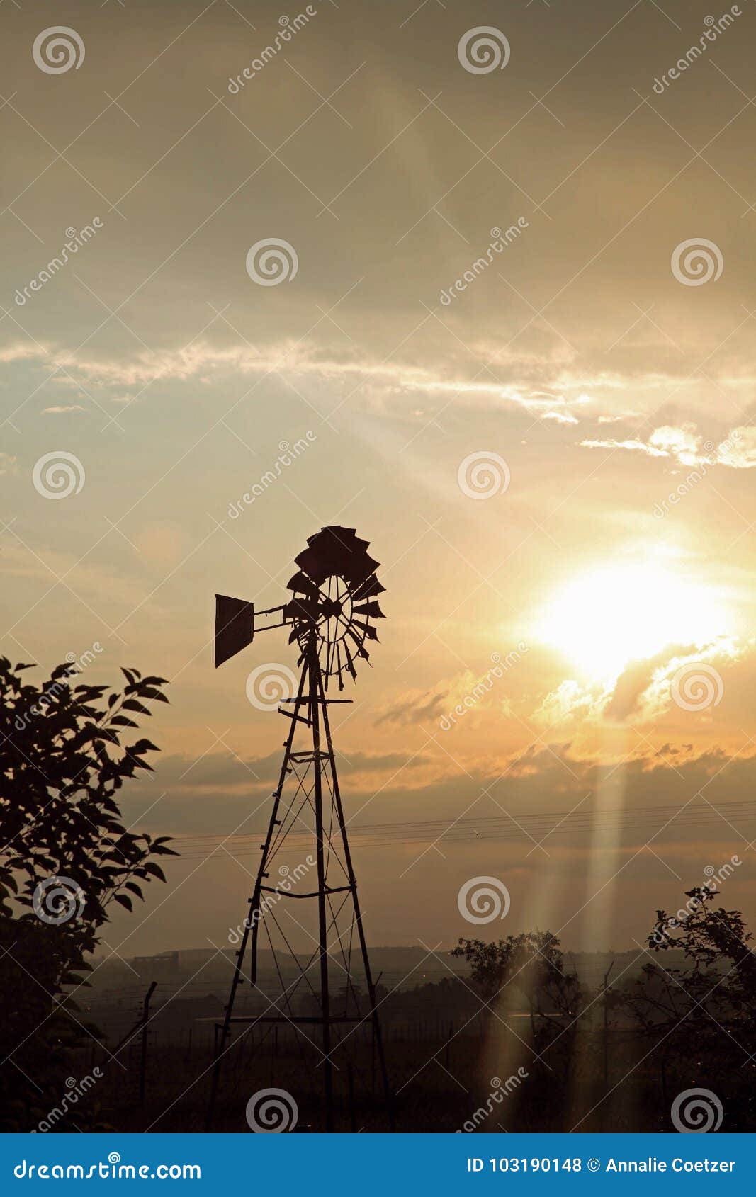 Windpump on a farm stock photo. Image of sunset, sundown - 103190148