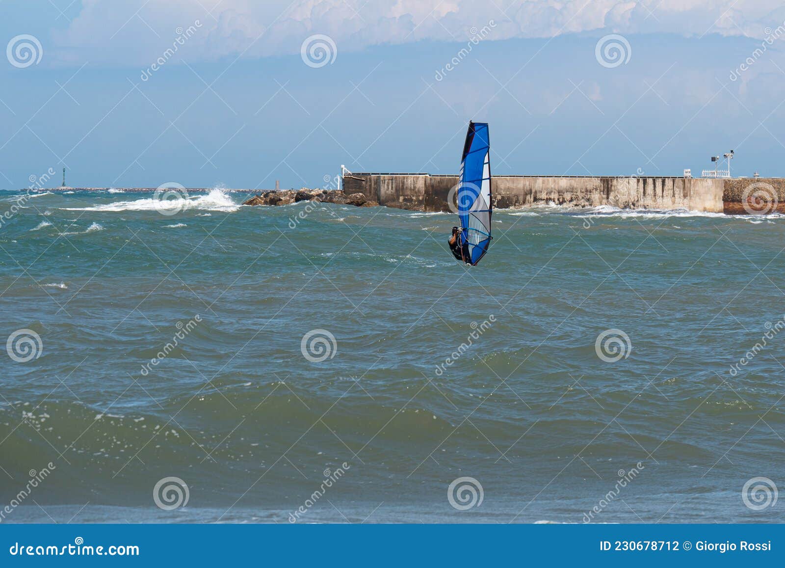 Windsurf Riding the Waves in a Choppy Sea Editorial Photography - Image ...