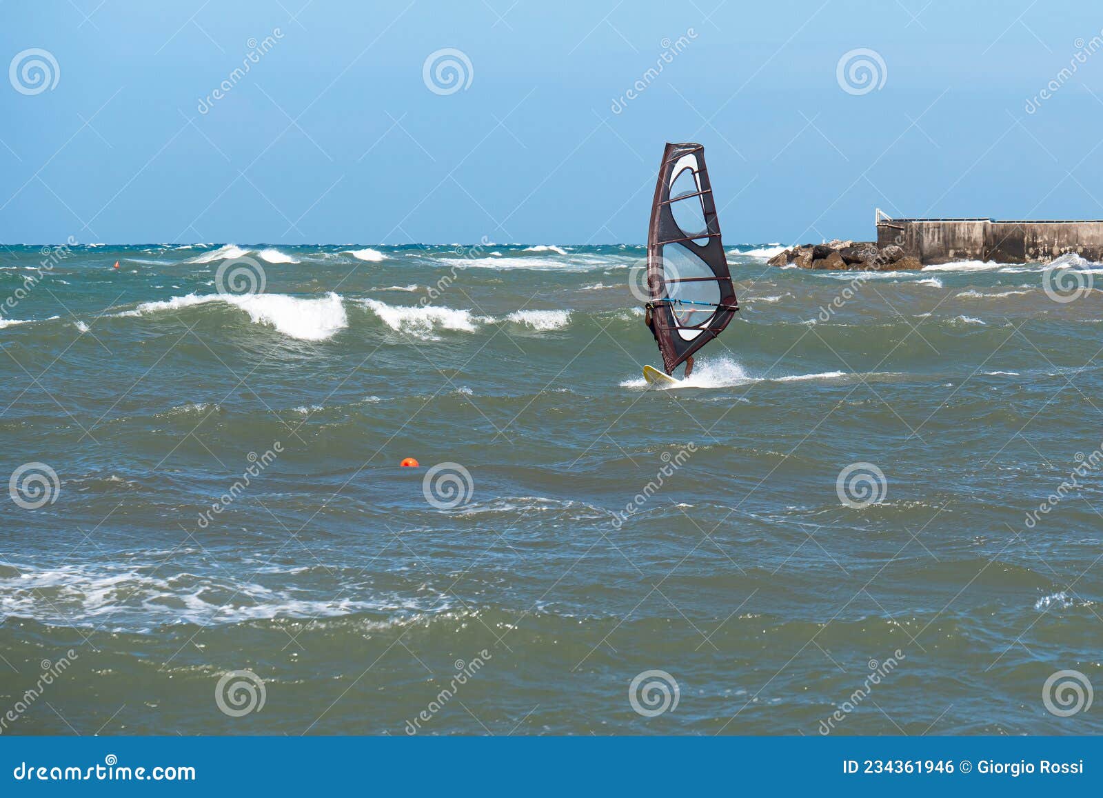 Windsurf Riding the Waves in a Choppy Sea Editorial Photo - Image of ...