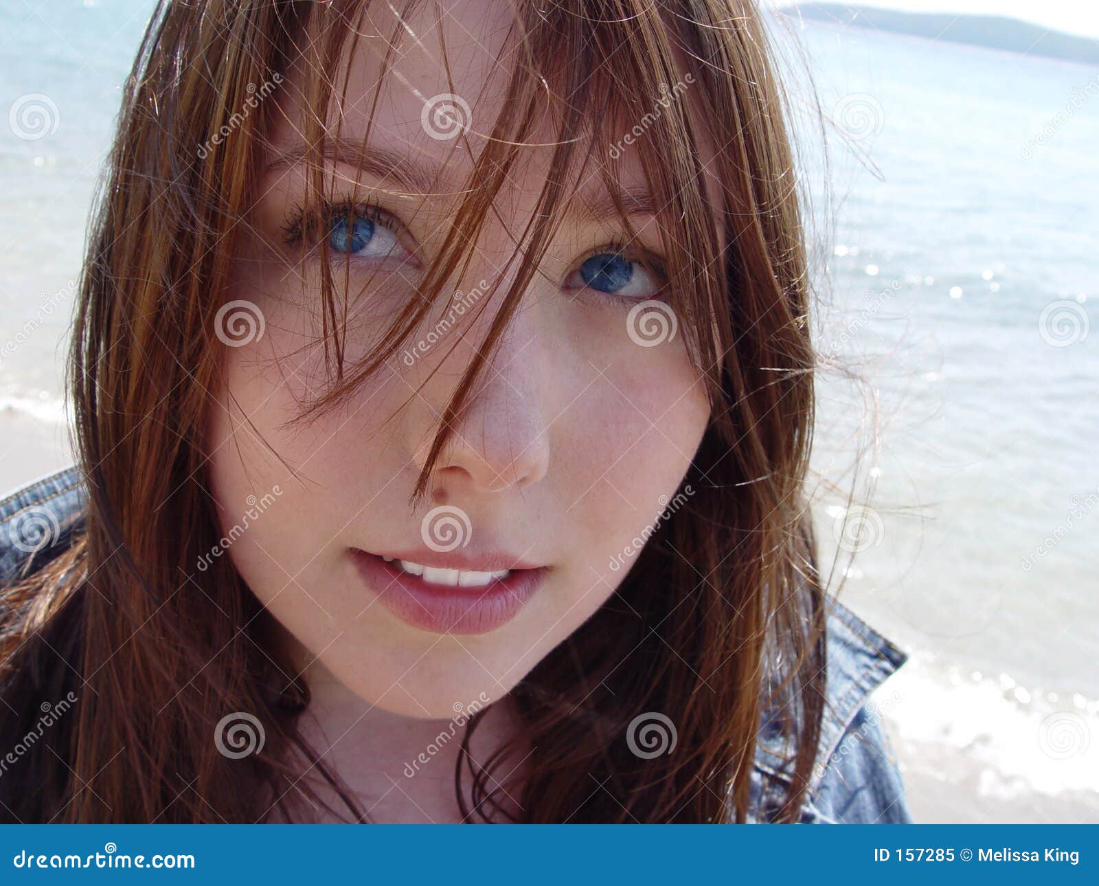 Windswept woman by sea stock image. Image of stares, outdoors - 157285