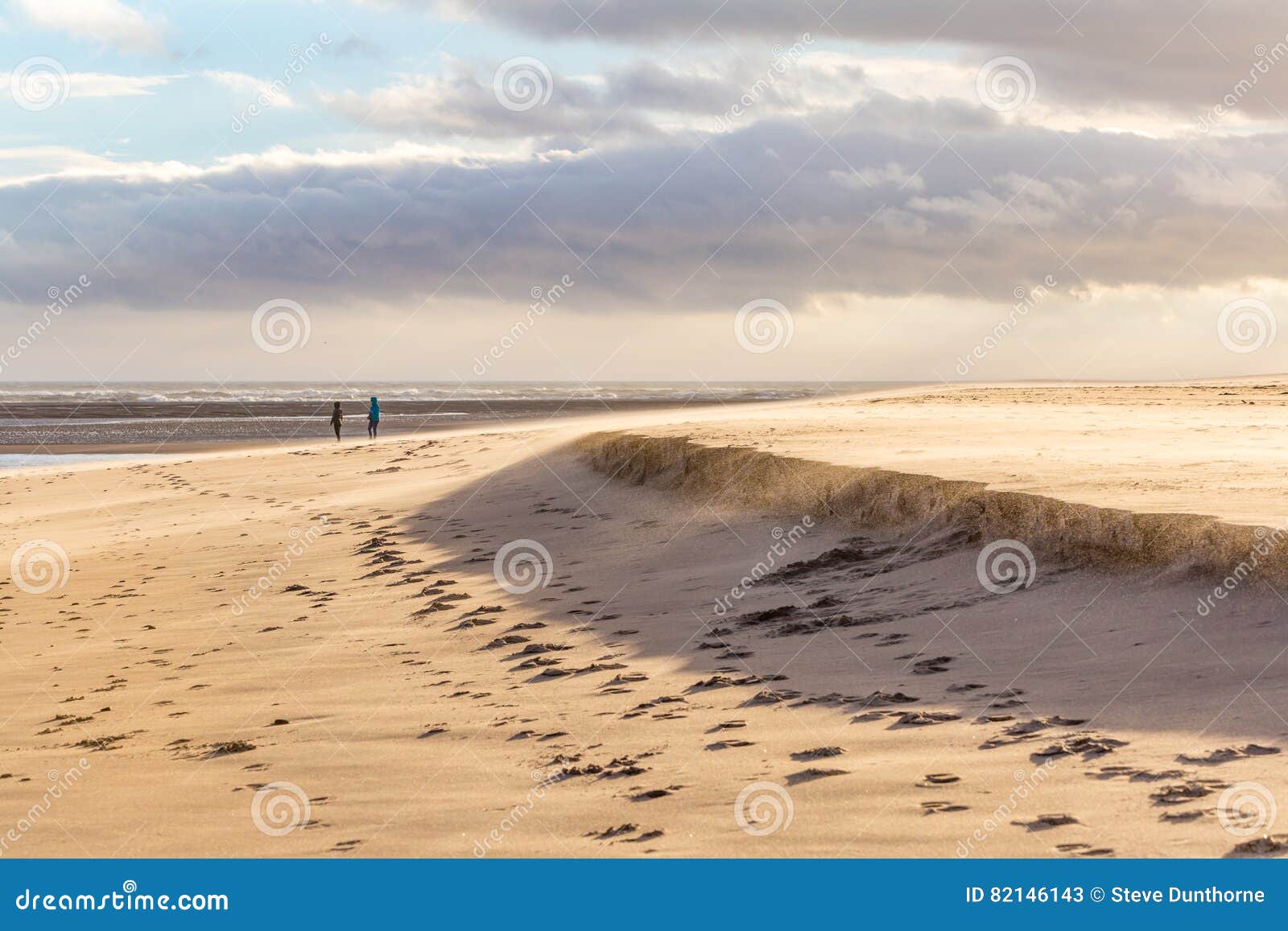 Windy Beach with Blowing Sand Stock Image - Image of sunny, clouds ...