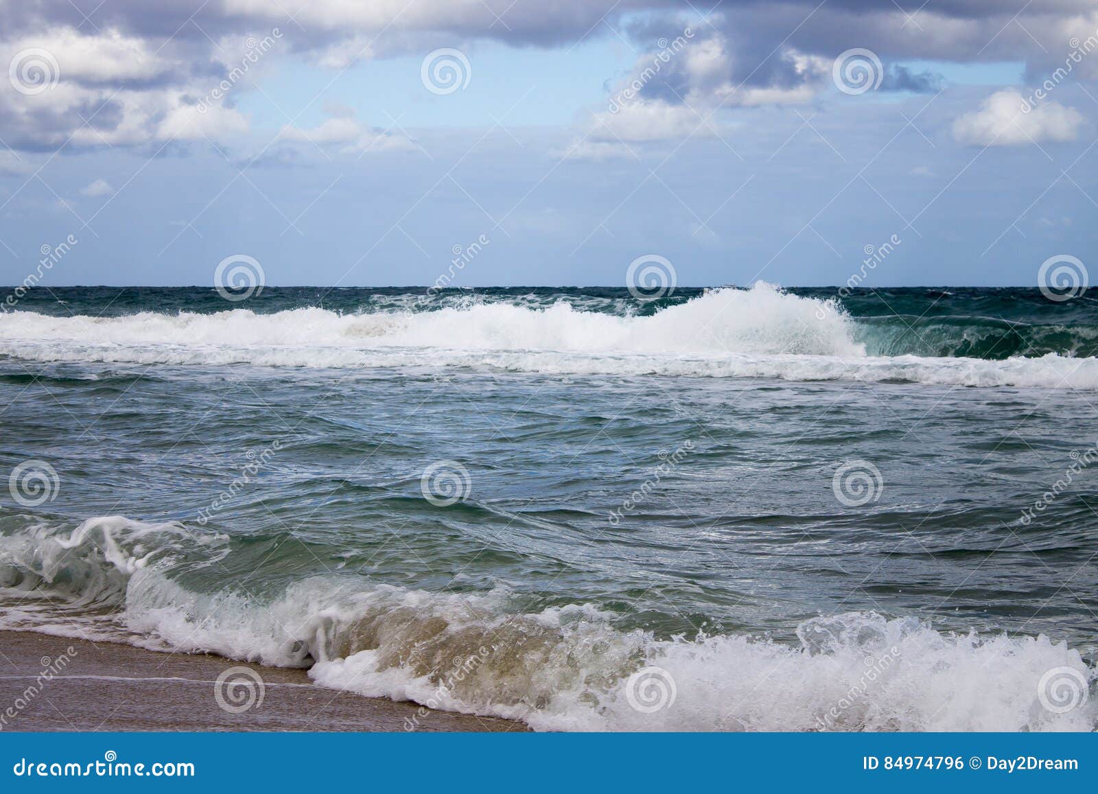 Windy Beach Day stock photo. Image of blue, beach, waves - 84974796